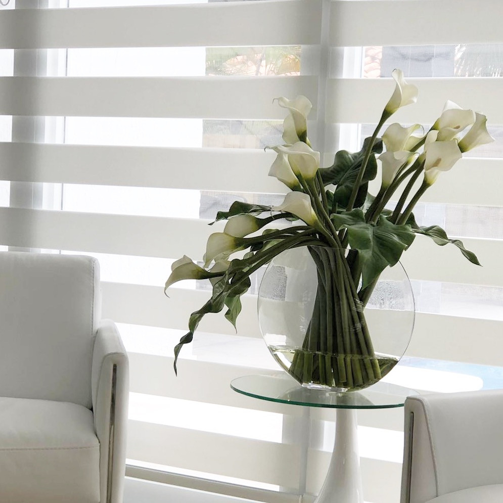 Moon vase with white calla lilies - CFA Design Group